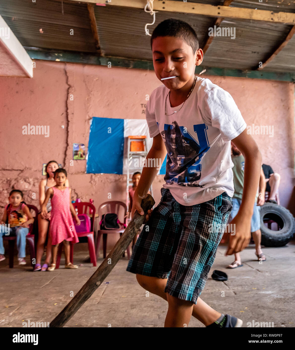 young latin boy swinging at pinata at Guatemalan birthday party Stock ...