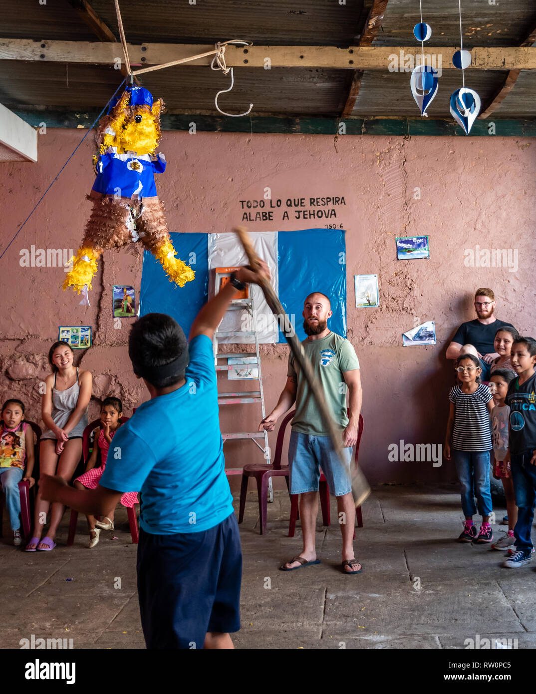 young latin boy swinging at pinata at Guatemalan birthday party Stock ...