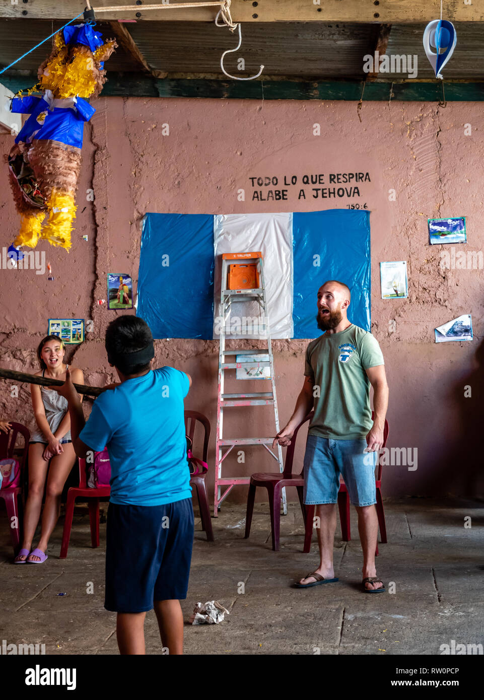 young latin boy swinging at pinata at Guatemalan birthday party Stock ...