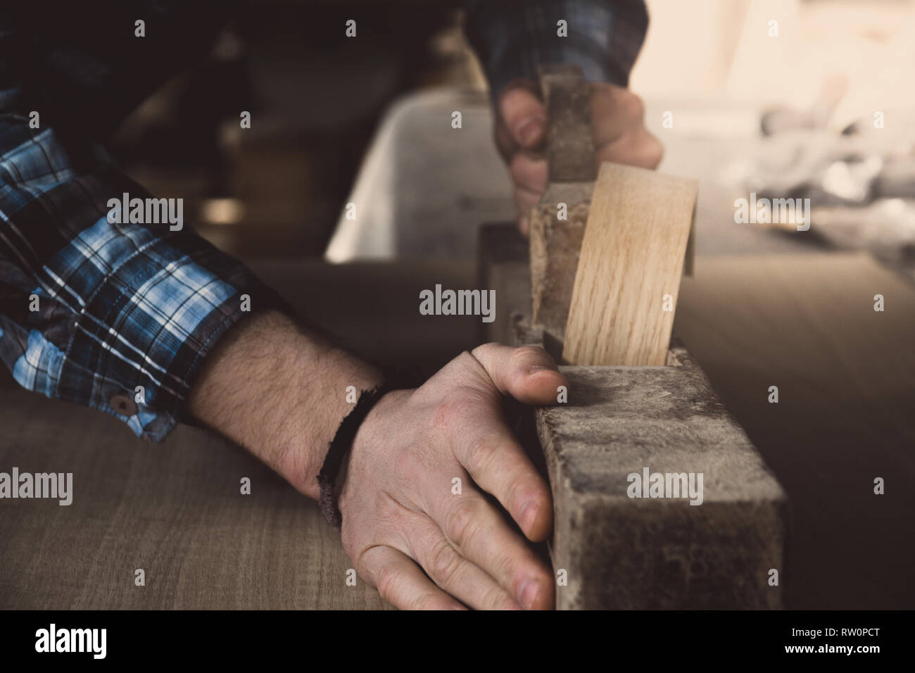 Vintage carpenter working on wood using wood retro vintage old ancient ...