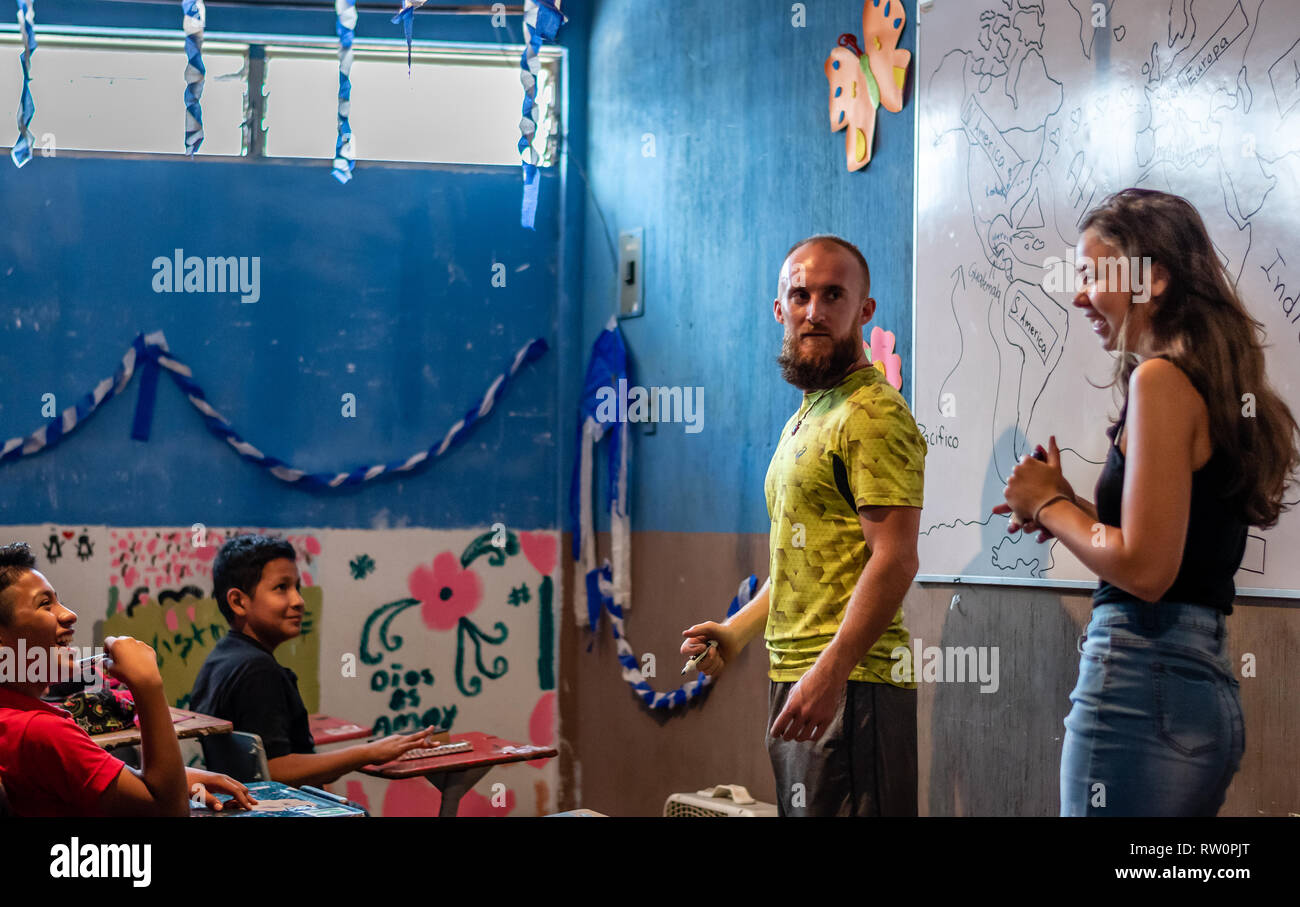 man and woman teaching latin children in Guatemalan classroom Stock ...