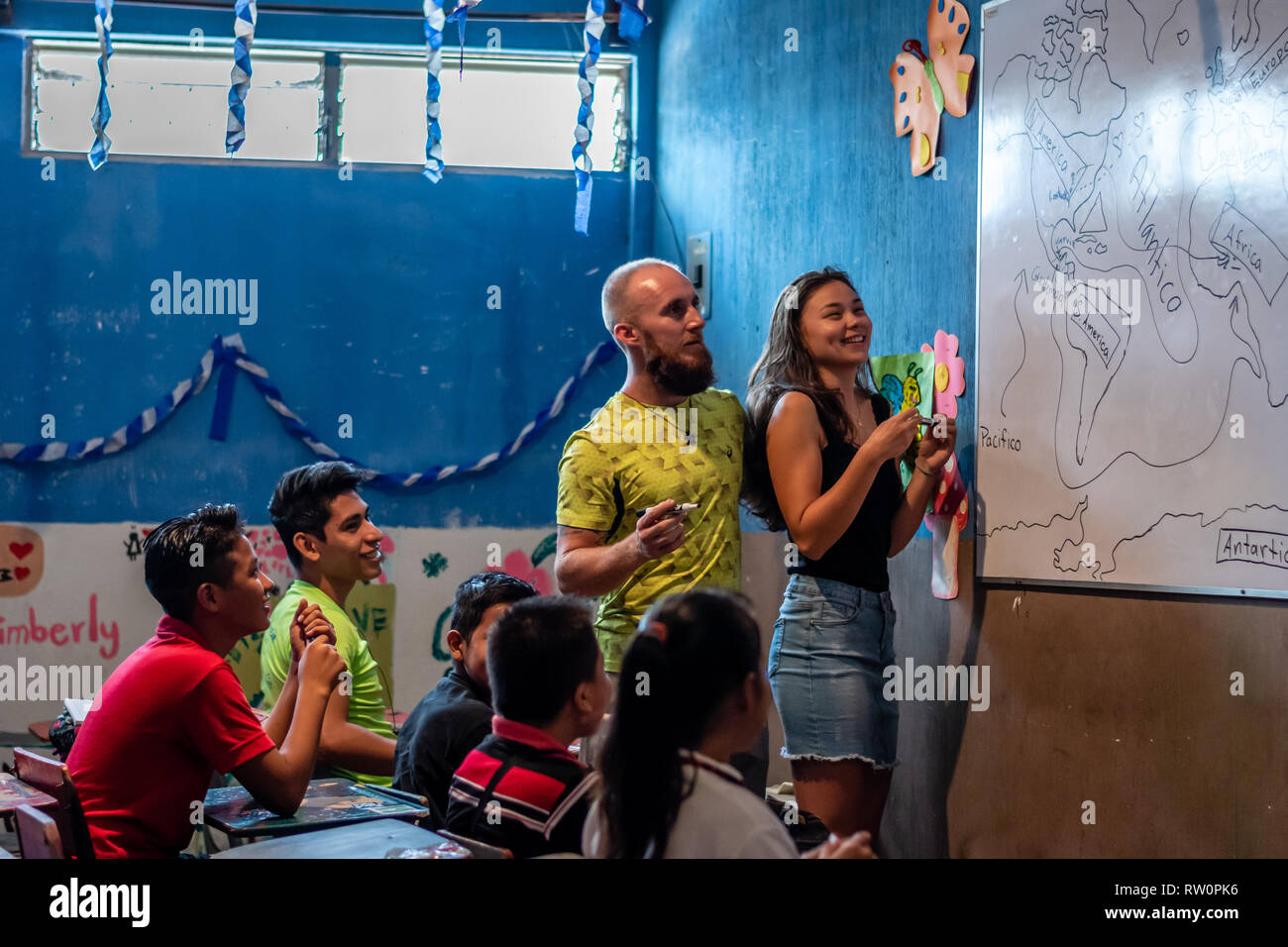 man and woman teaching latin children in Guatemalan classroom Stock ...