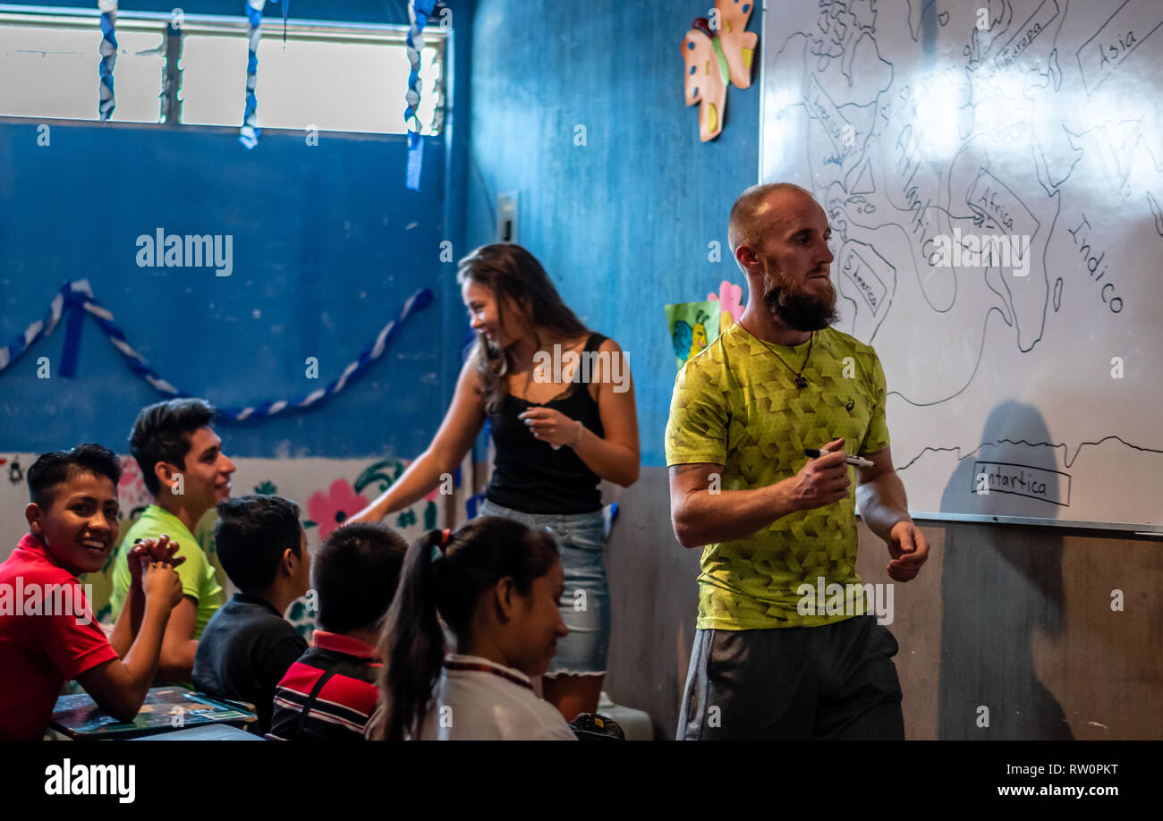 man and woman teaching latin children in Guatemalan classroom Stock ...