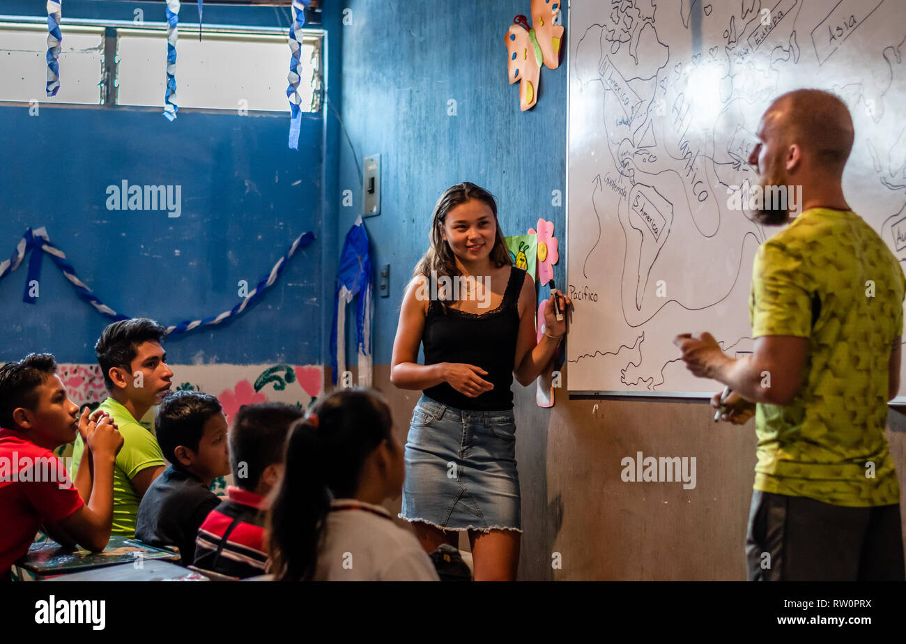 man and woman teaching latin children in Guatemalan classroom Stock ...