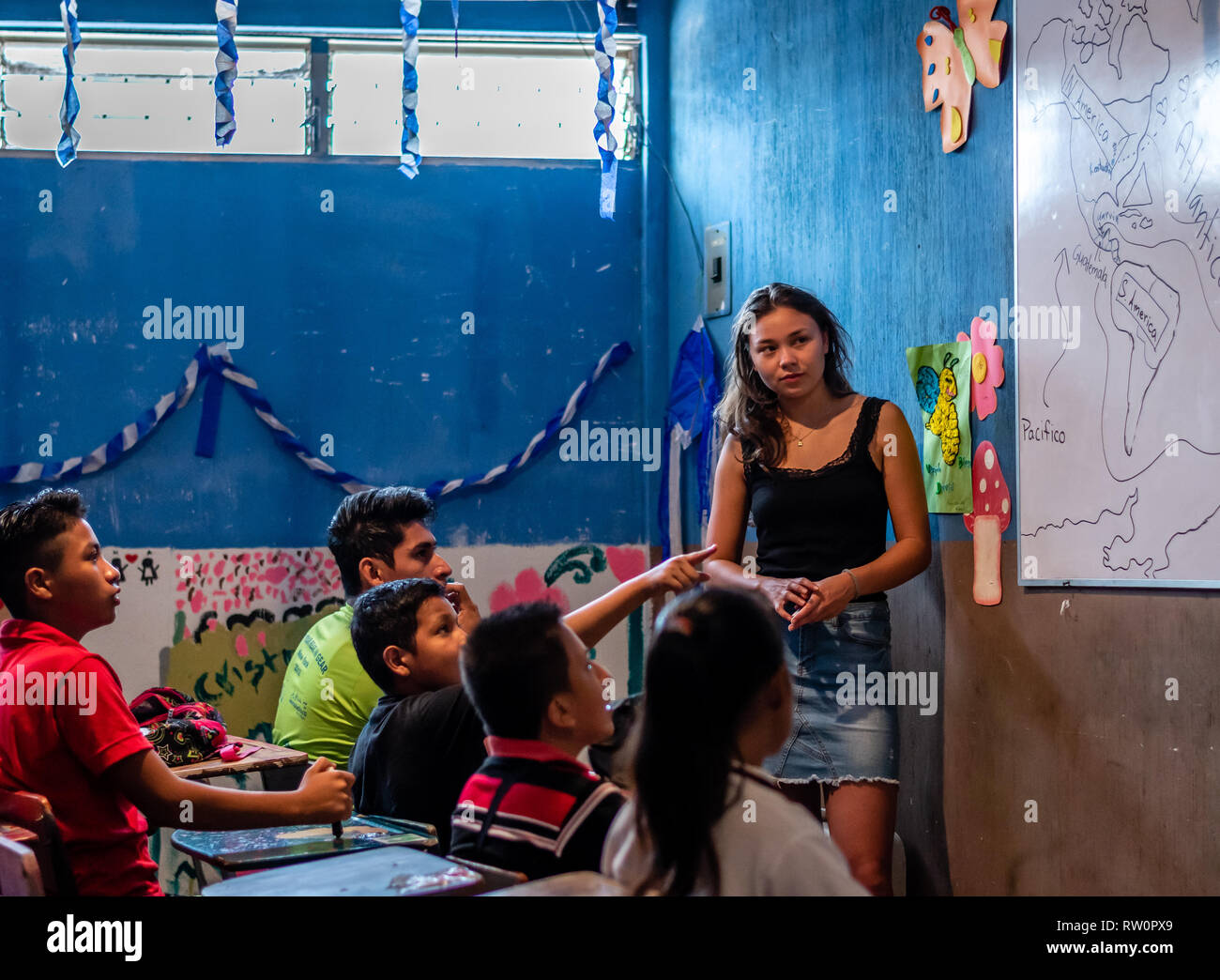 man and woman teaching latin children in Guatemalan classroom Stock ...