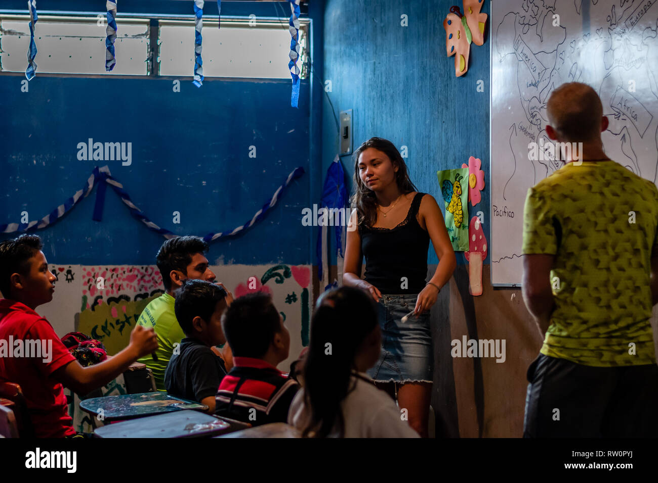 man and woman teaching latin children in Guatemalan classroom Stock ...