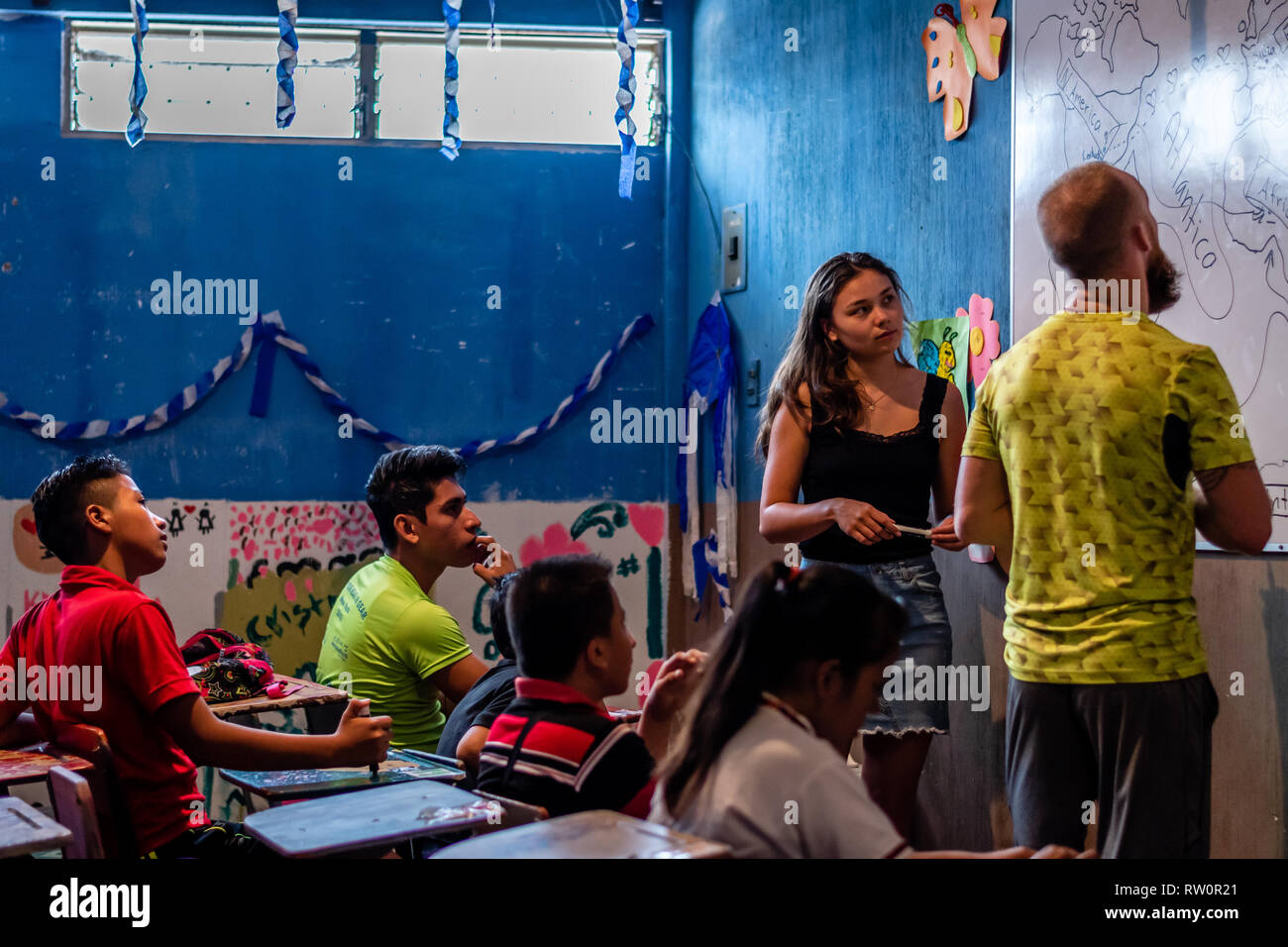 man and woman teaching latin children in Guatemalan classroom Stock ...