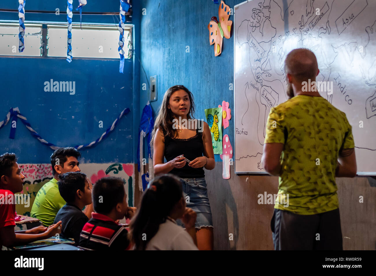 man and woman teaching latin children in Guatemalan classroom Stock ...