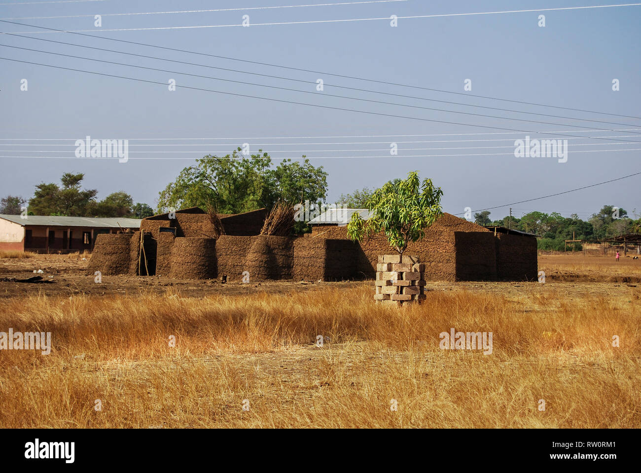 A photo of a house (building) under construction in a savanna of ...