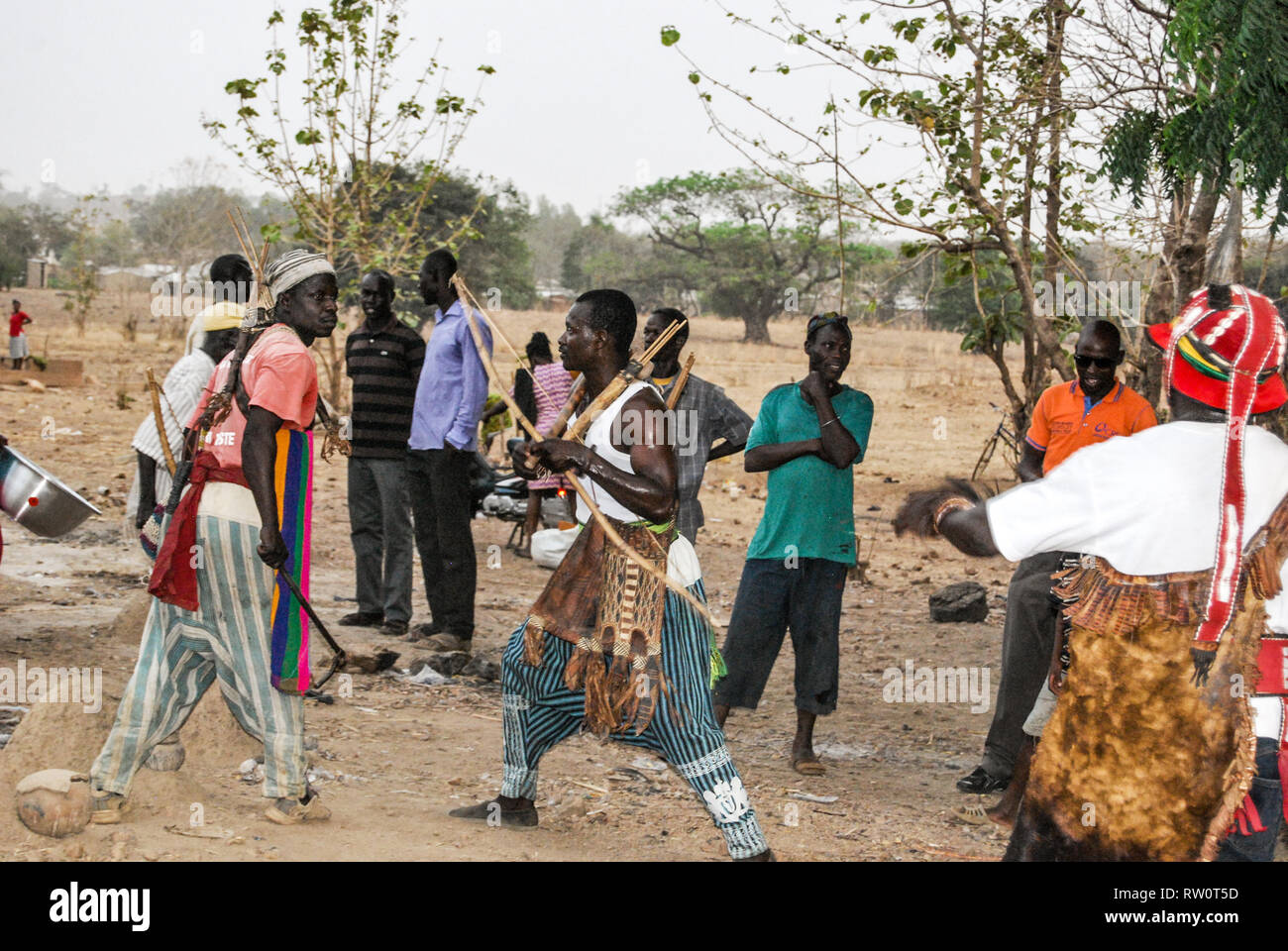Ghanaian men wearing traditional clothes mixed with modern ones ...
