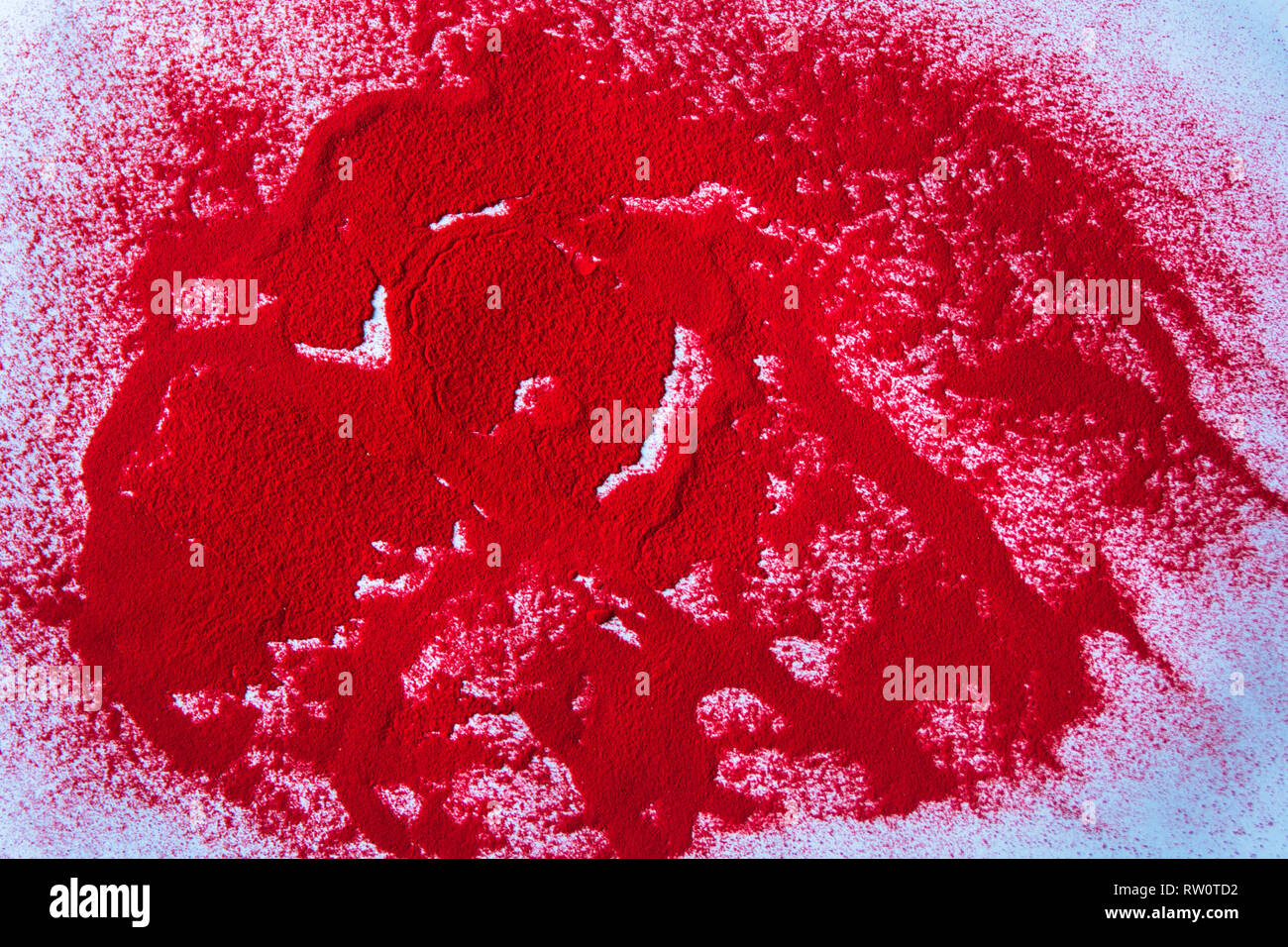 Powder paint explosion red background hi-res stock photography and ...