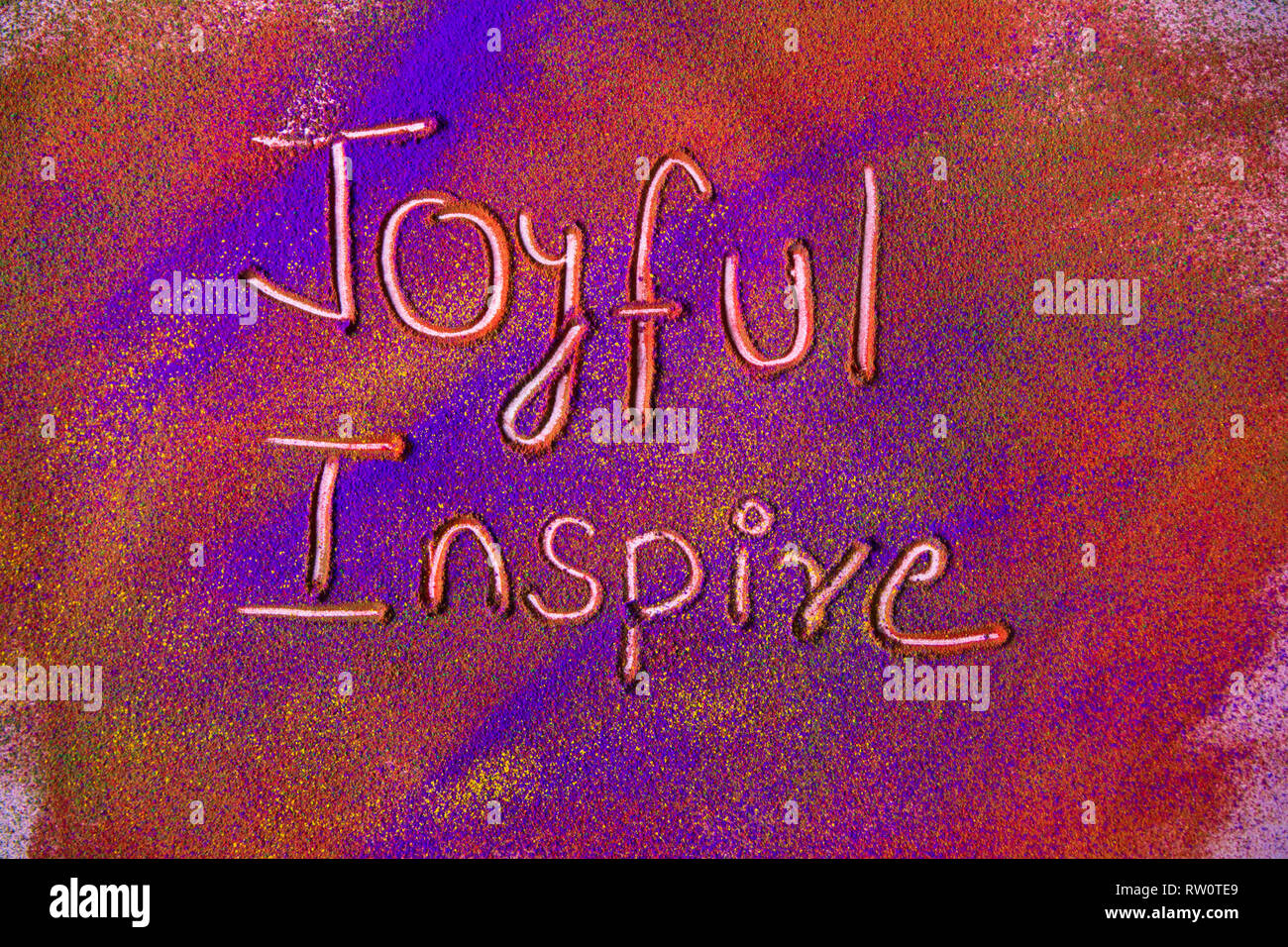 Joyful and Inspire word on colorful powder Stock Photo - Alamy