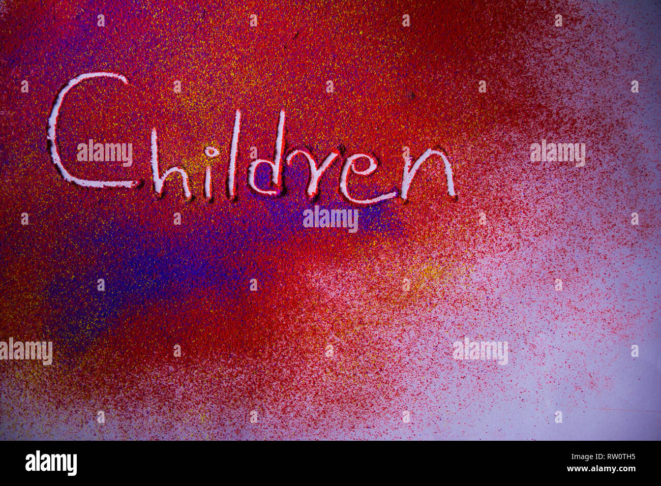 Children word on colorful color powder Stock Photo - Alamy