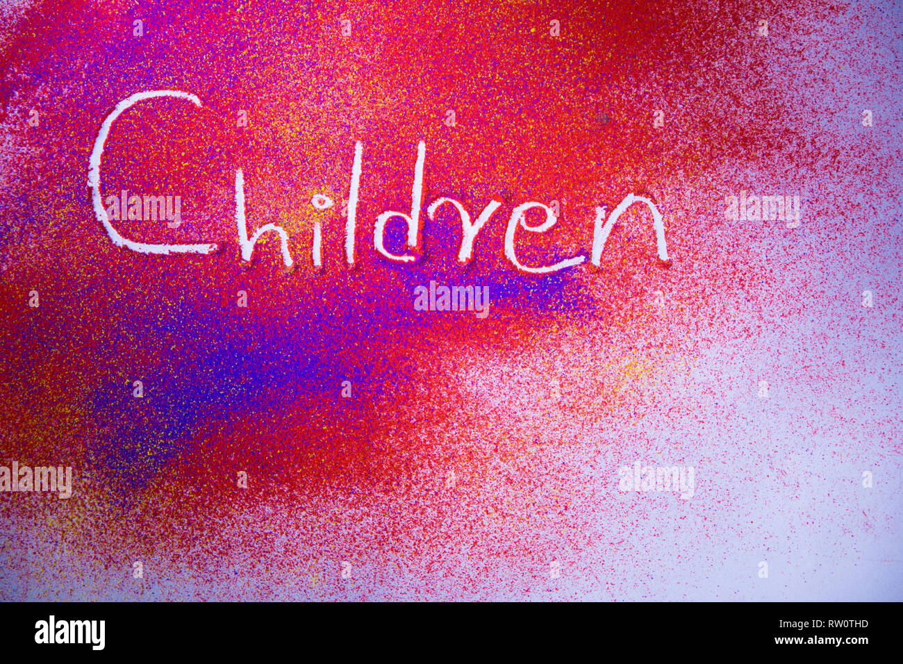 Children word on colorful color powder Stock Photo - Alamy
