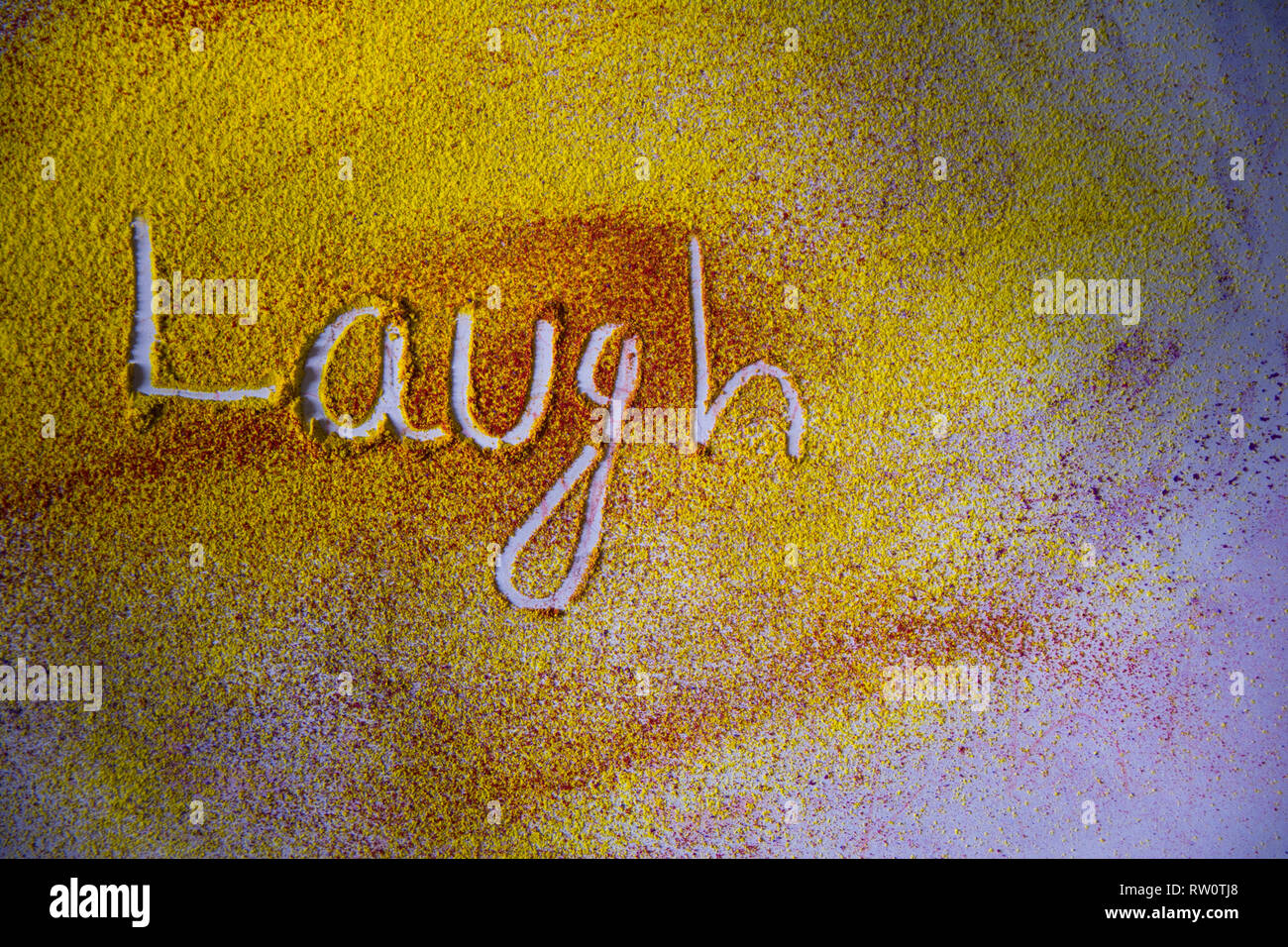 Colorful Powder written word Laugh Stock Photo - Alamy
