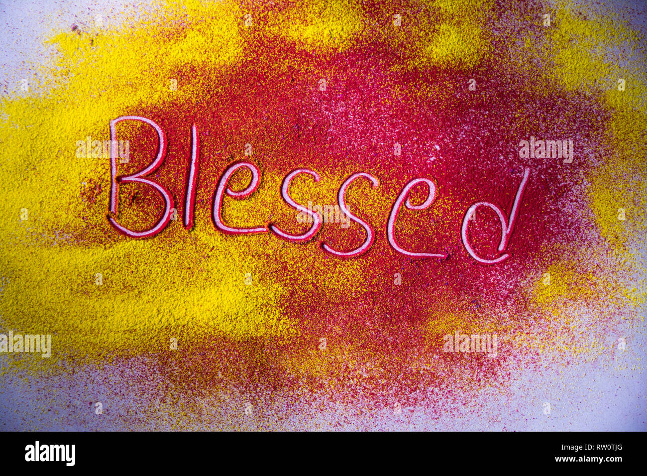 Colorful Powder written word Blessed Stock Photo - Alamy