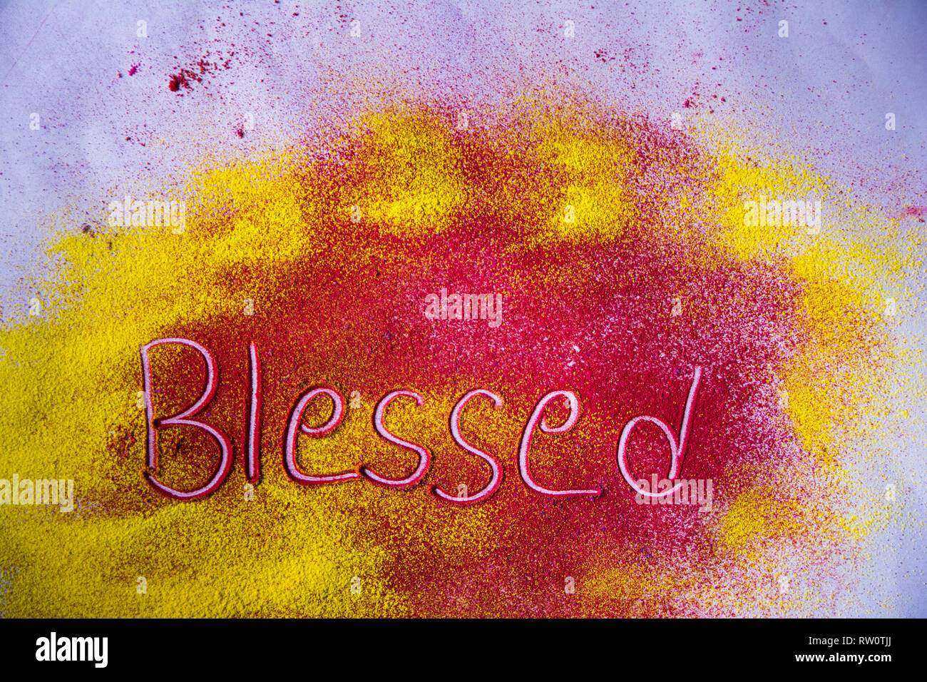 Colorful Powder written word Blessed Stock Photo - Alamy