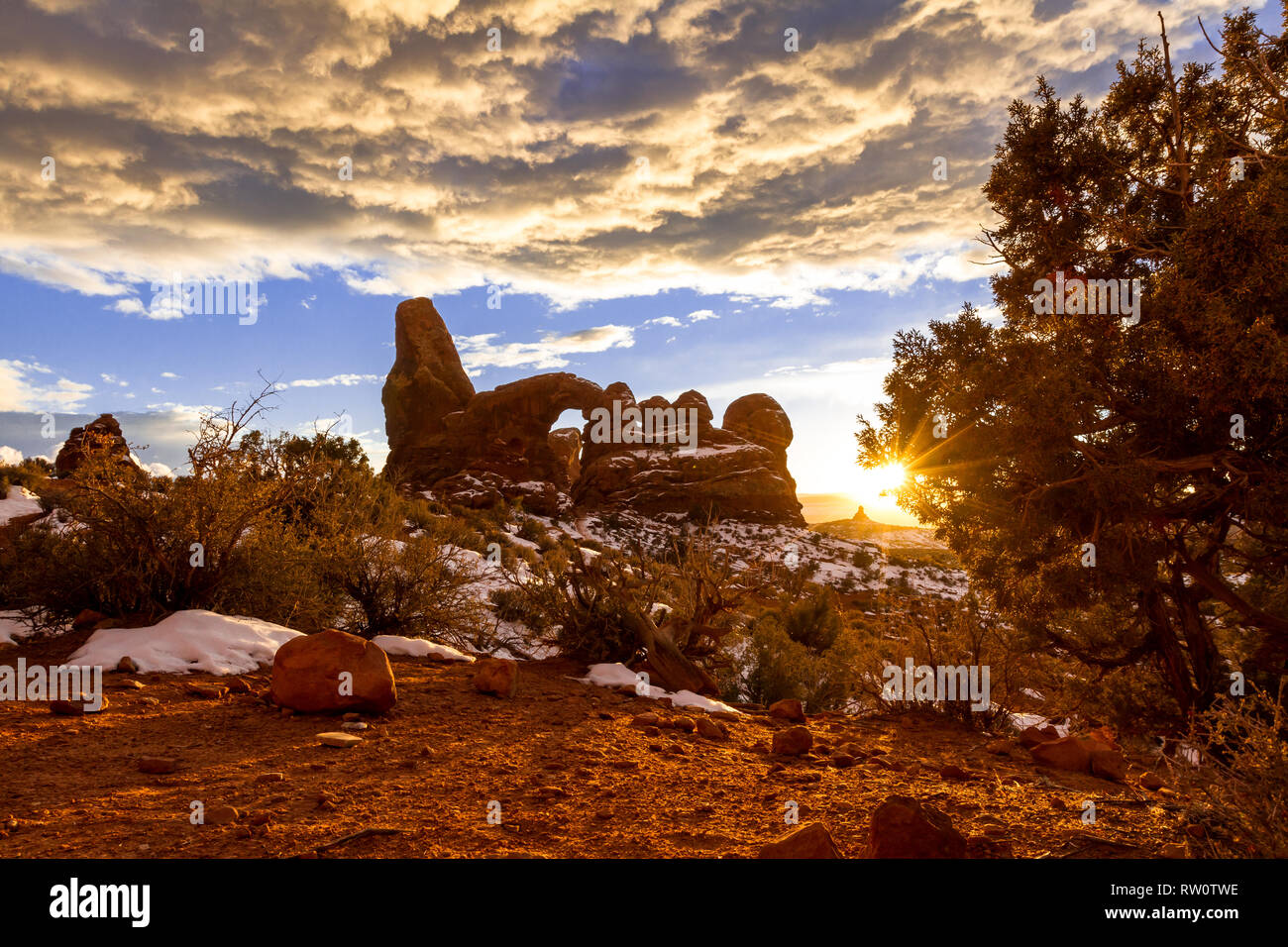 Beautiful scene with the sun setting behind Turret Arch and amazing ...