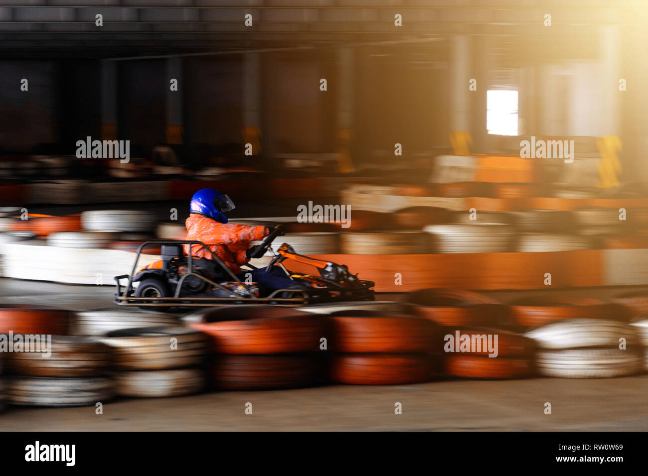Dynamic karting competition at speed with blurry motion on an equipped ...