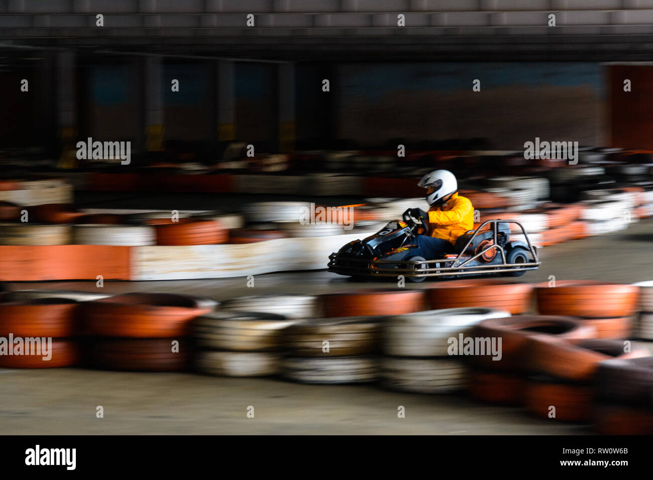 Dynamic karting competition at speed with blurry motion on an equipped ...
