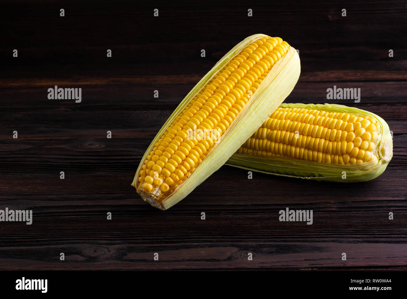Sweet Corn on wooden table background Stock Photo - Alamy