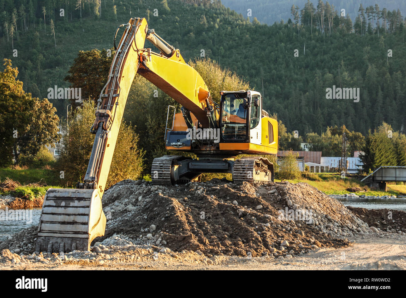 Excavator digging in river hi-res stock photography and images - Alamy