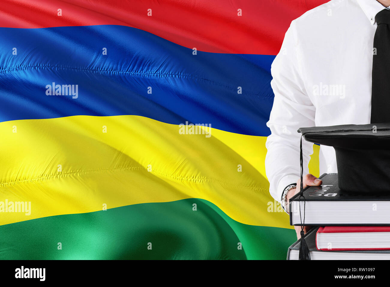 Successful Mauritian student education concept. Holding books and ...