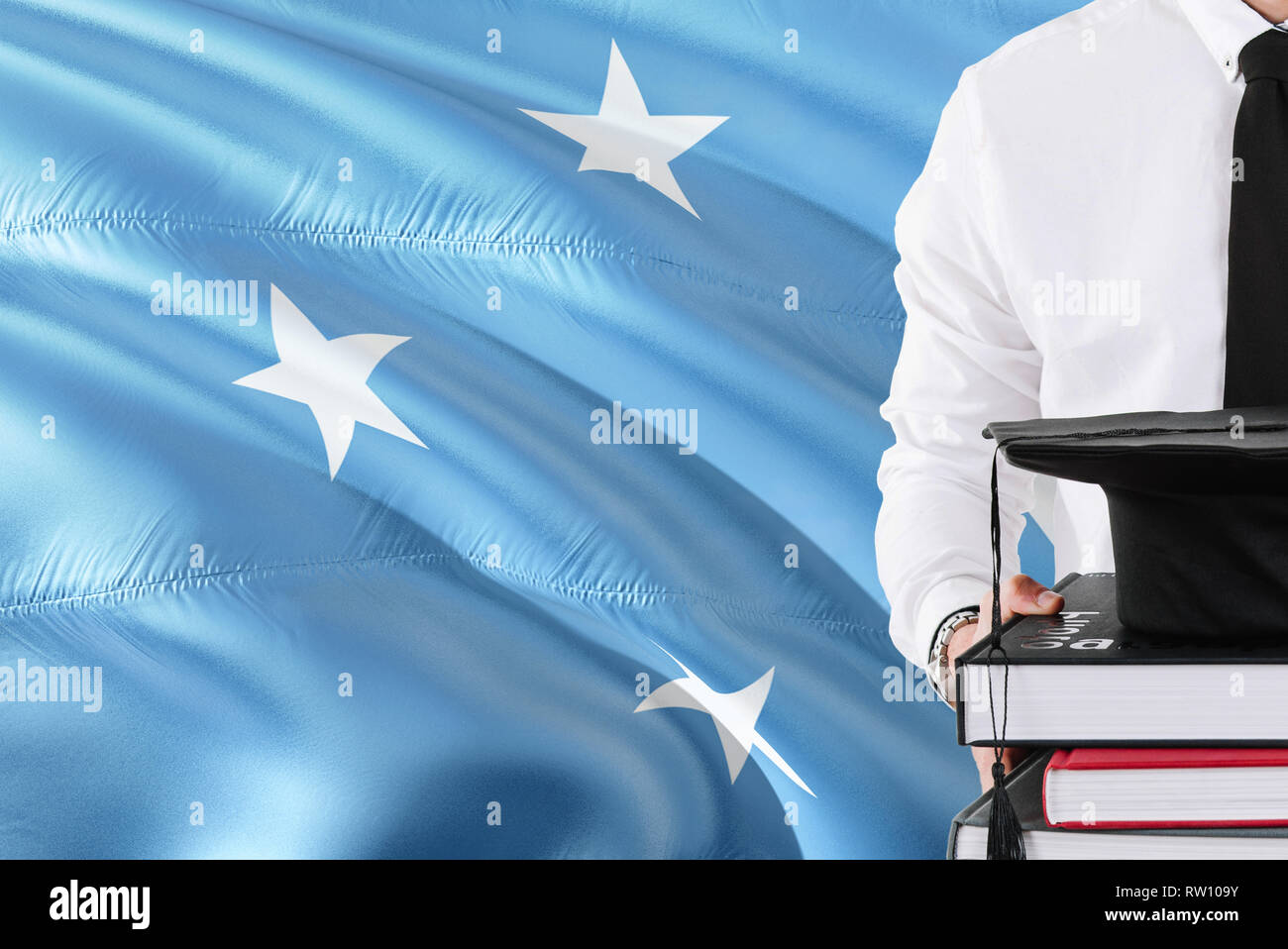 Successful Micronesian student education concept. Holding books and ...