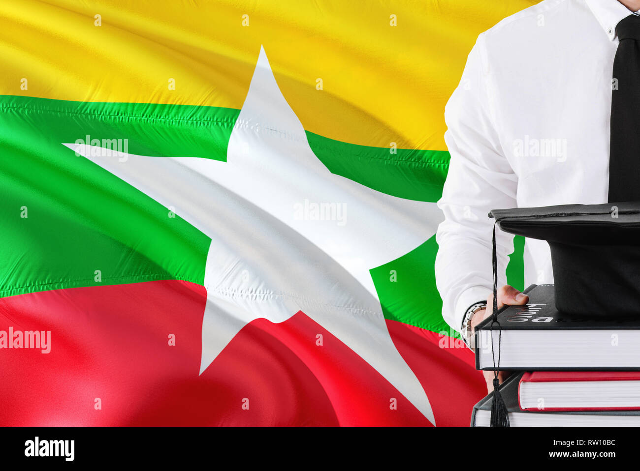 Successful Burmese student education concept. Holding books and ...