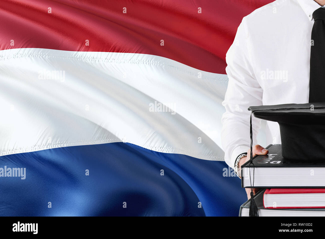 Successful Dutch student education concept. Holding books and ...