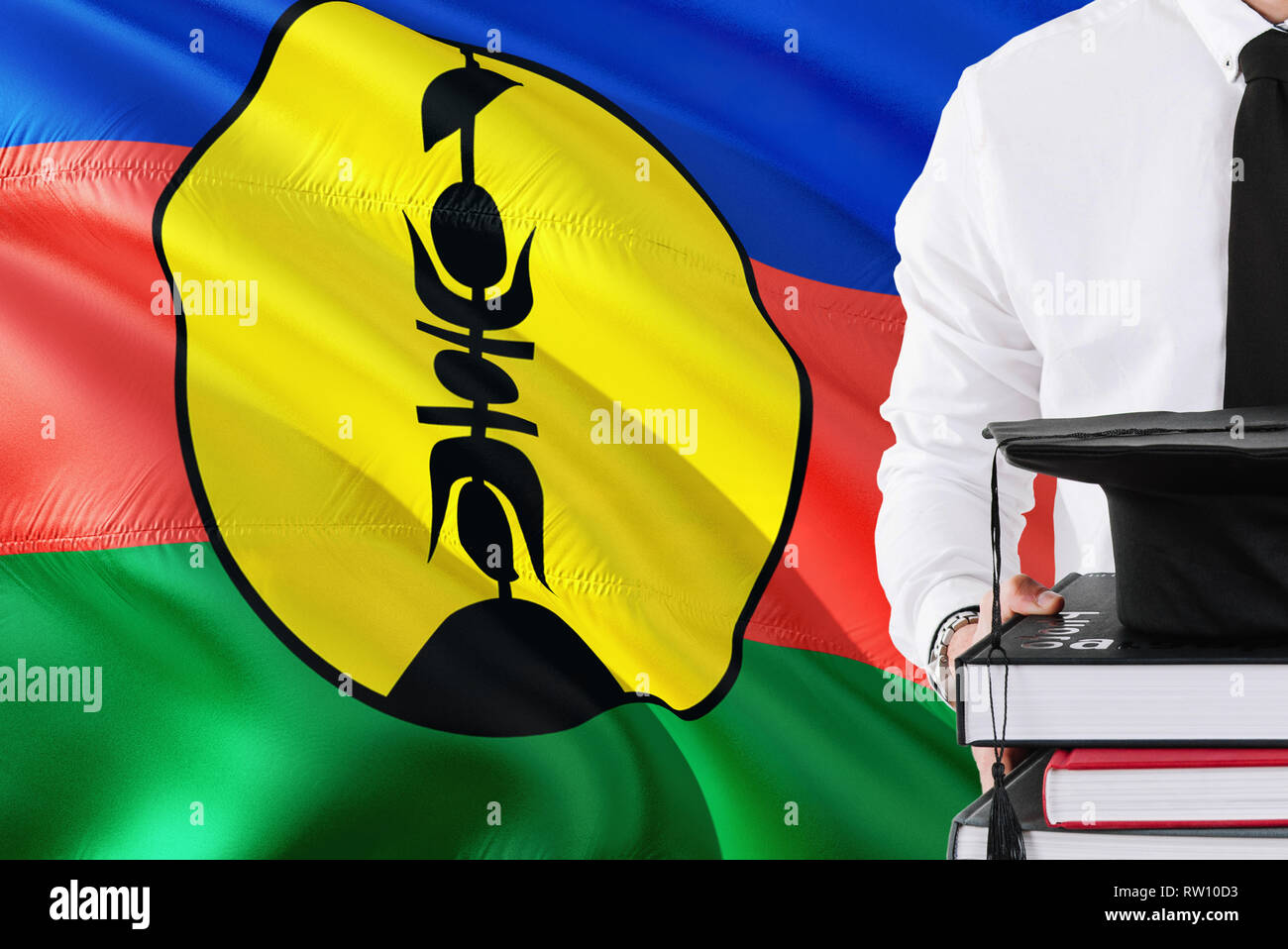 Successful student education concept. Holding books and graduation cap ...