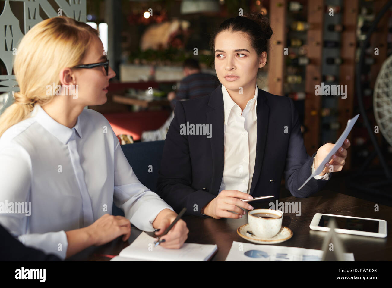 Discussing business document Stock Photo - Alamy