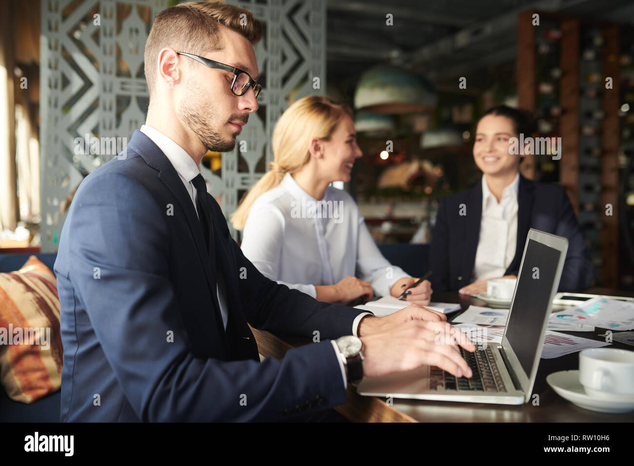 Man networking in cafe Stock Photo - Alamy