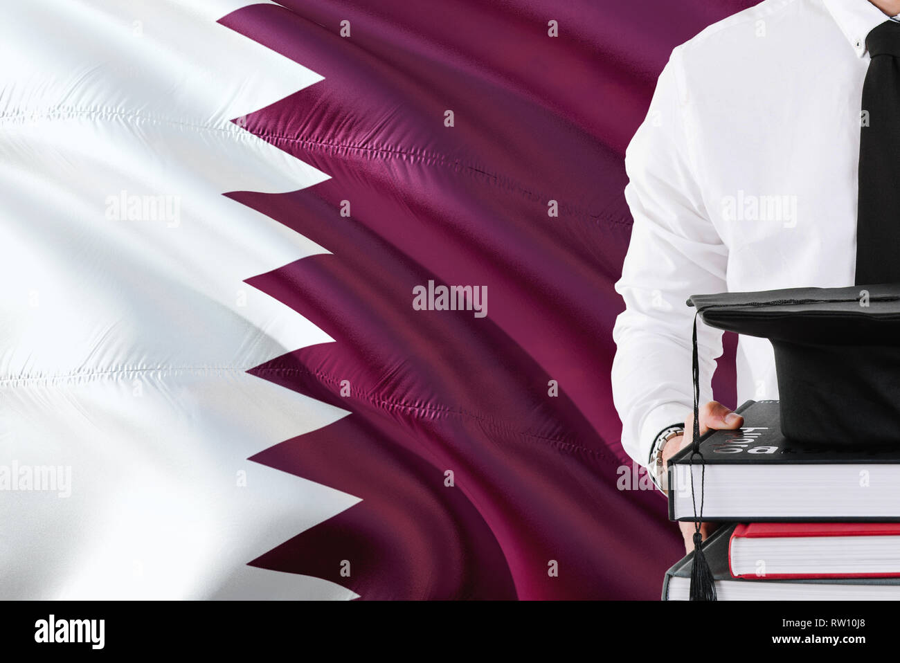 Successful Qatari student education concept. Holding books and ...
