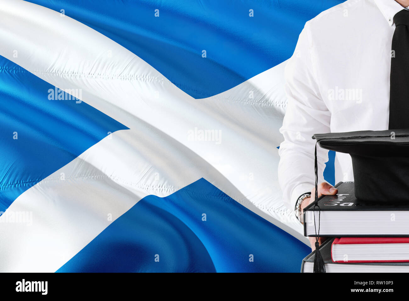 Successful Scottish student education concept. Holding books and ...