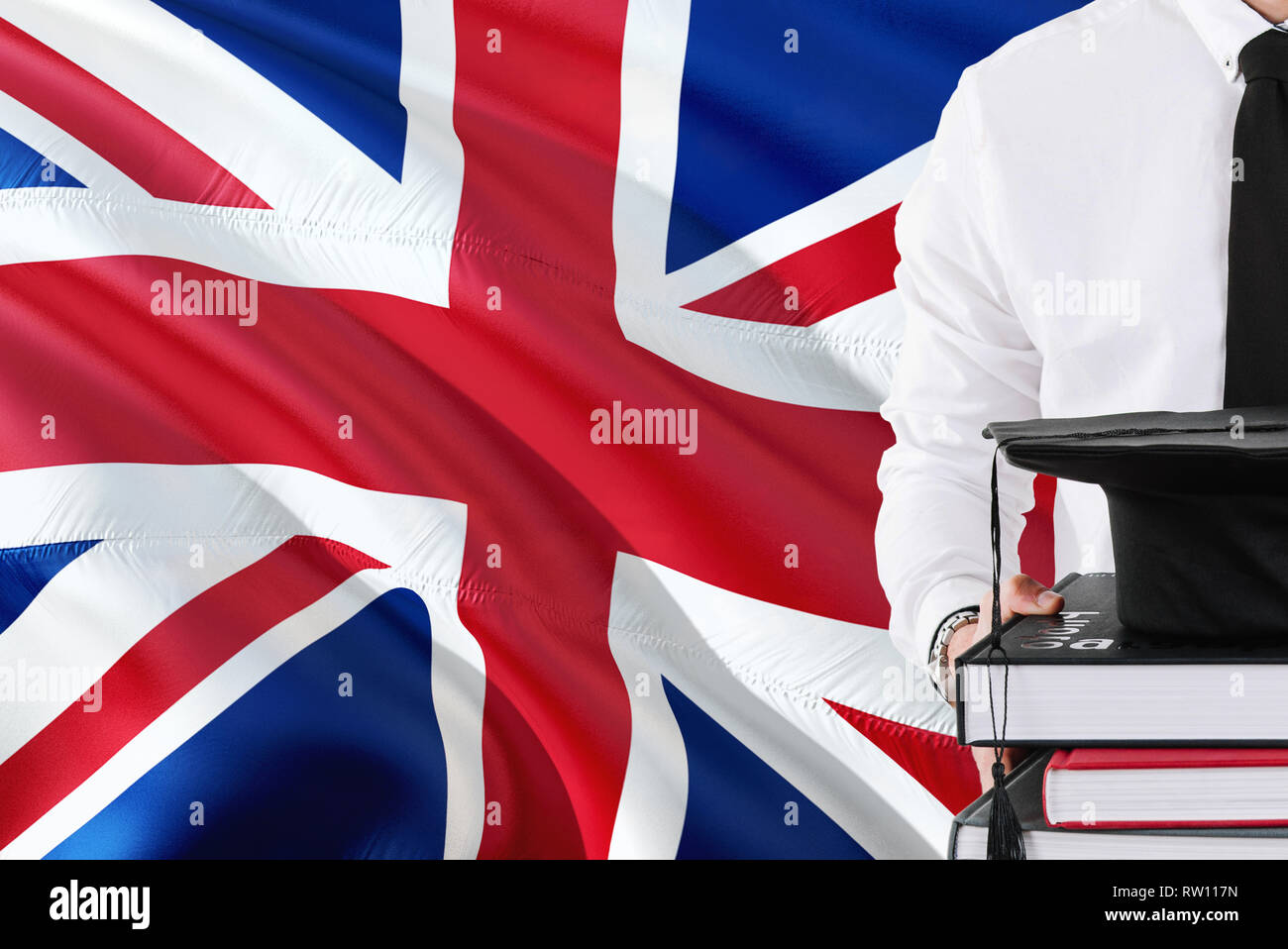 Successful British student education concept. Holding books and ...
