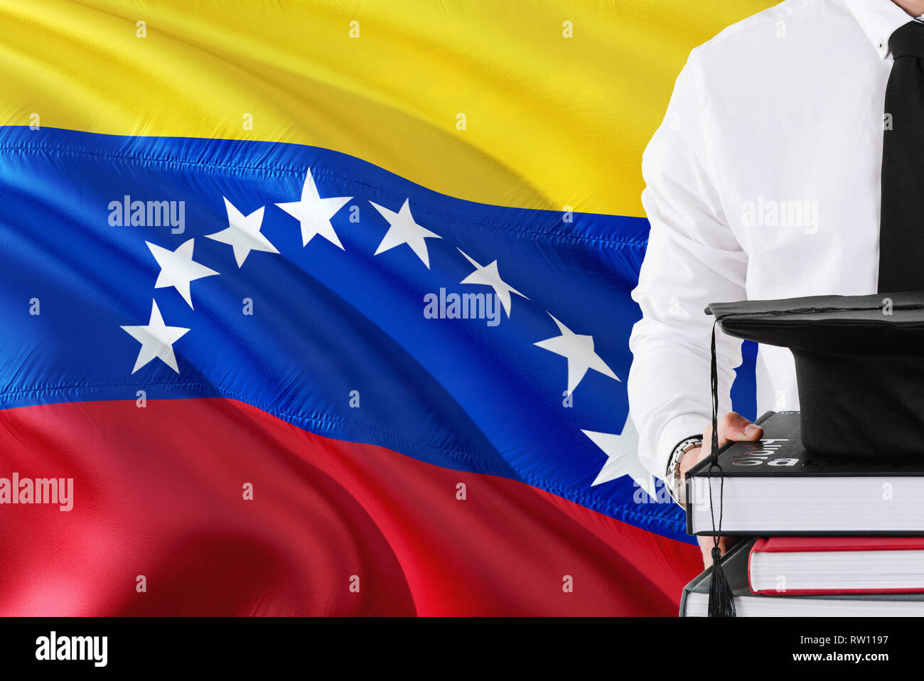 Successful Venezuelan student education concept. Holding books and ...