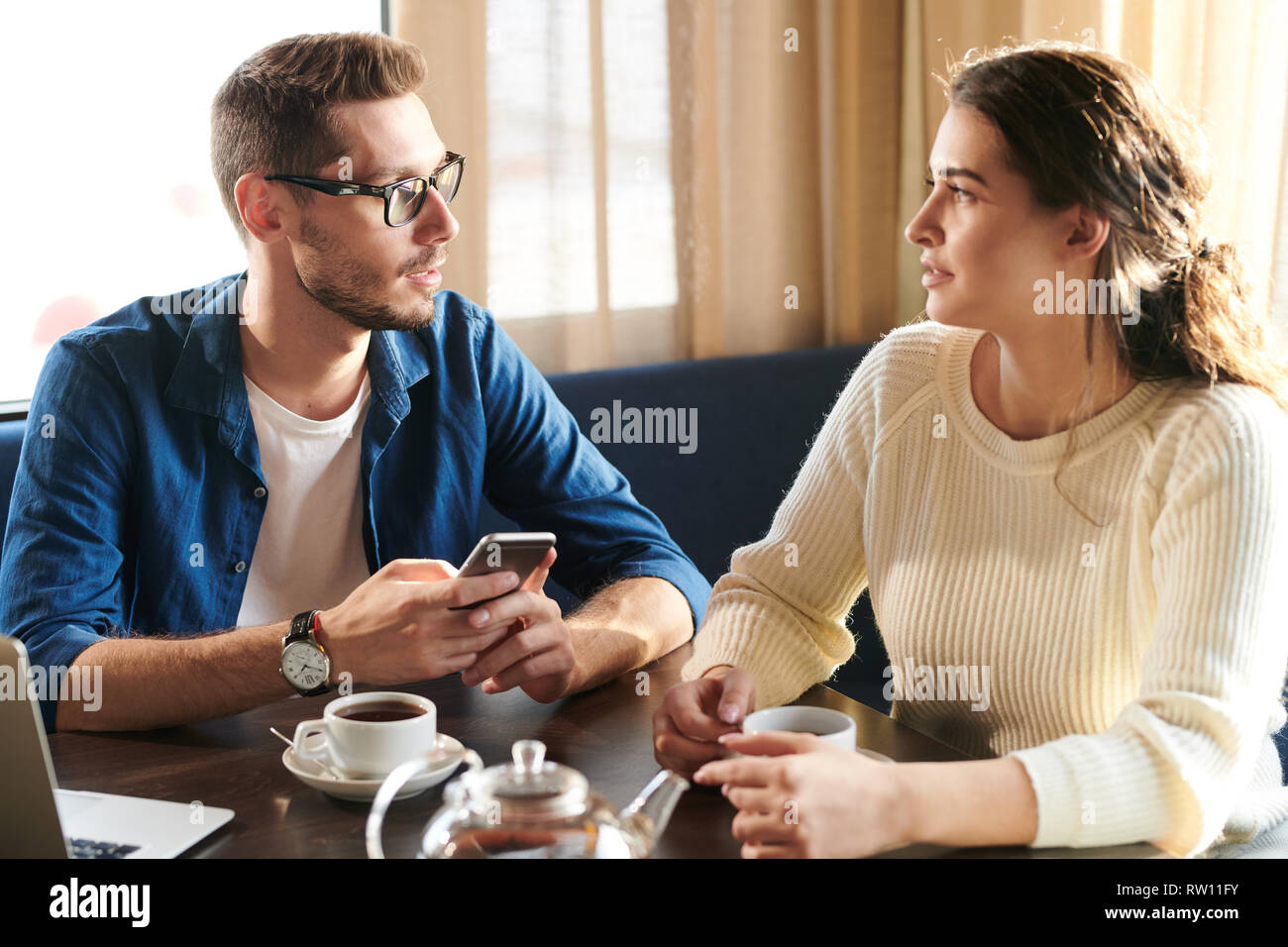 Talking by cup of tea Stock Photo - Alamy
