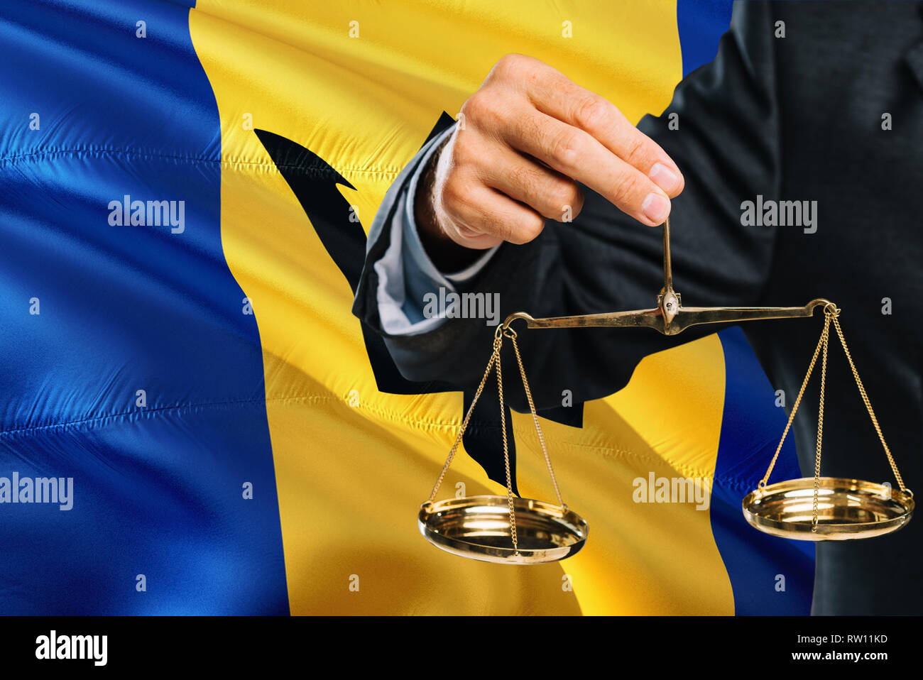 Barbadian Judge is holding golden scales of justice with Barbados ...