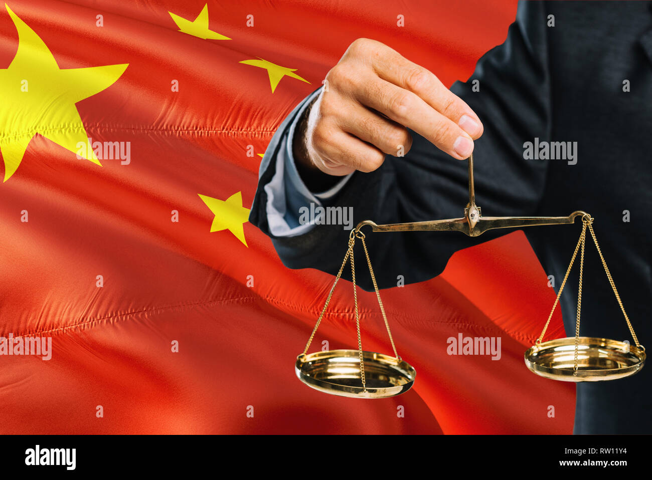 Chinese Judge is holding golden scales of justice with China waving ...