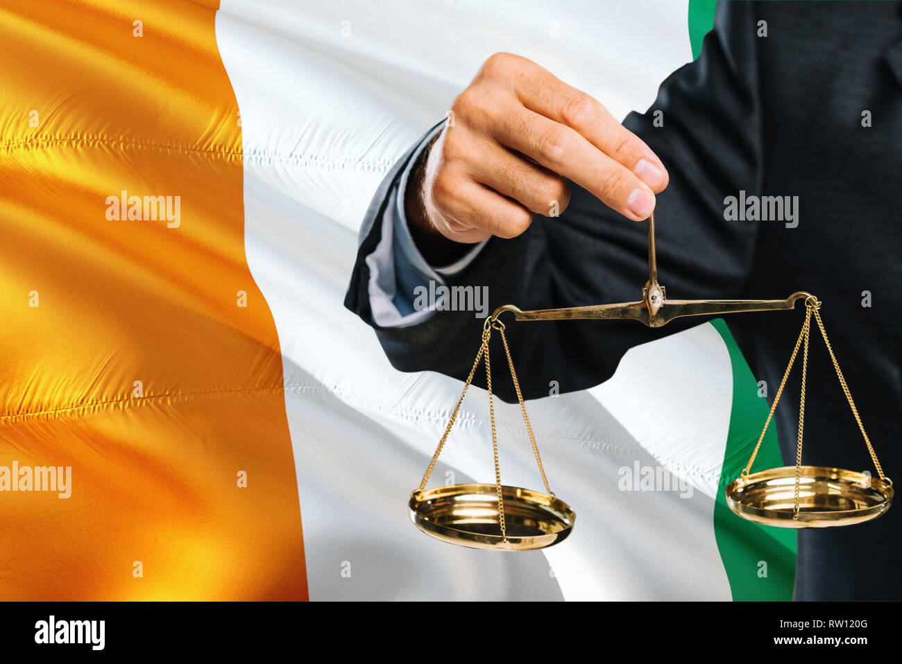 Ivorian Judge is holding golden scales of justice with Cote D'Ivoire ...