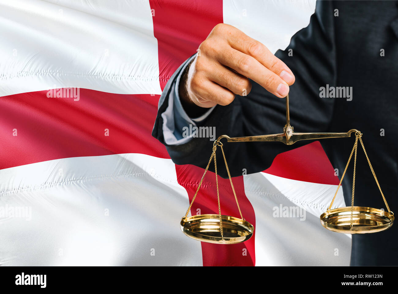 English Judge is holding golden scales of justice with England waving ...