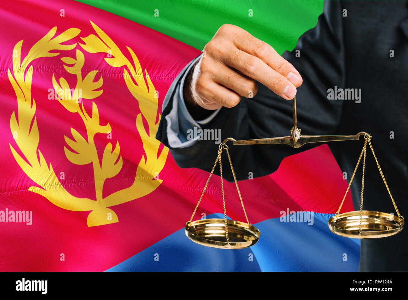 Eritrean Judge is holding golden scales of justice with Eritrea waving ...