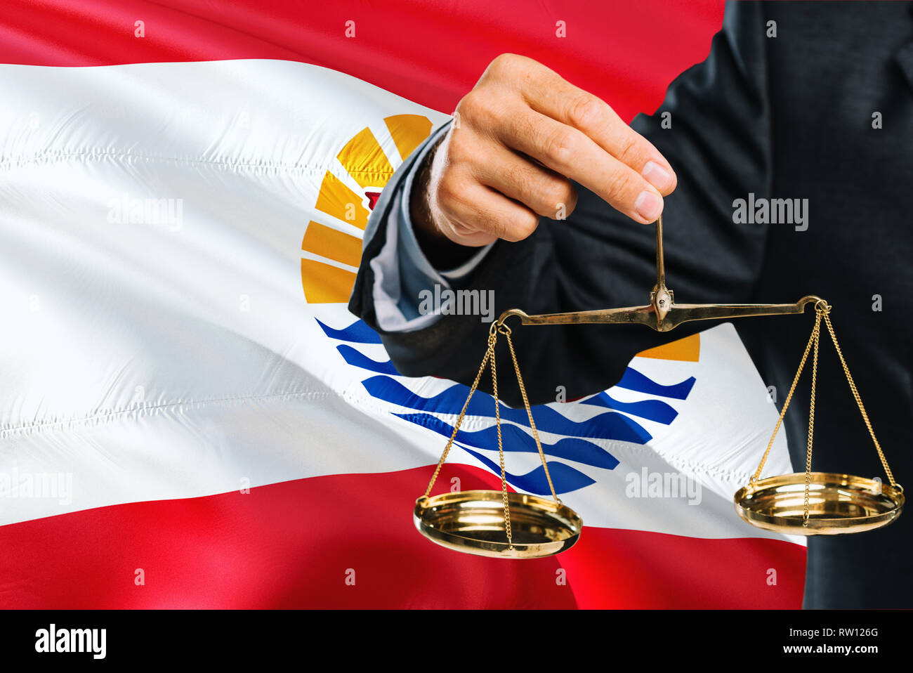Judge is holding golden scales of justice with French Polynesia waving ...