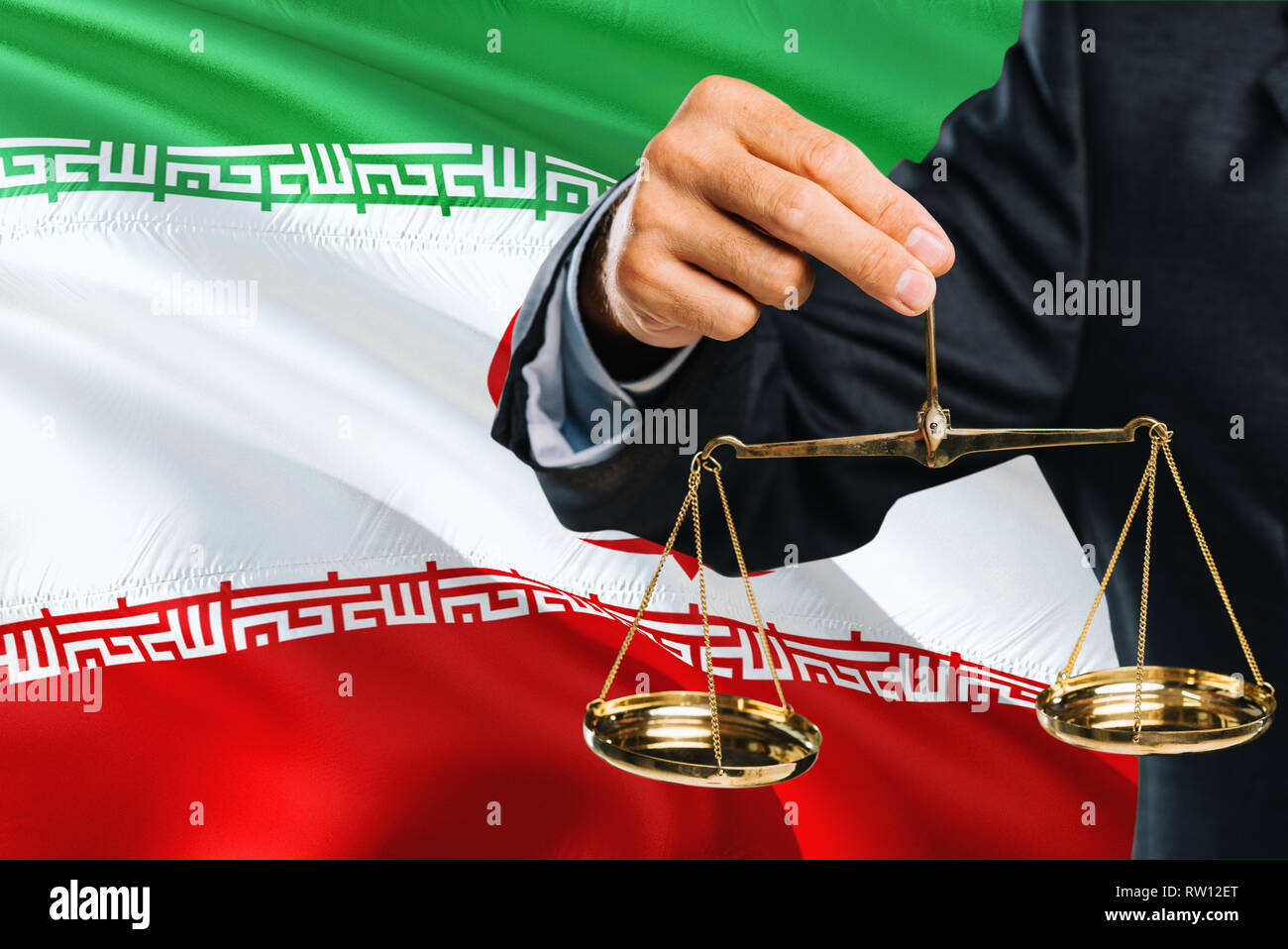 Iranian Judge is holding golden scales of justice with Iran waving flag ...