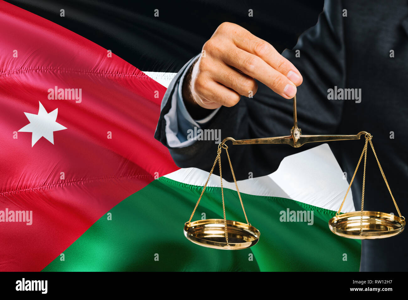 Jordanian Judge is holding golden scales of justice with Jordan waving ...