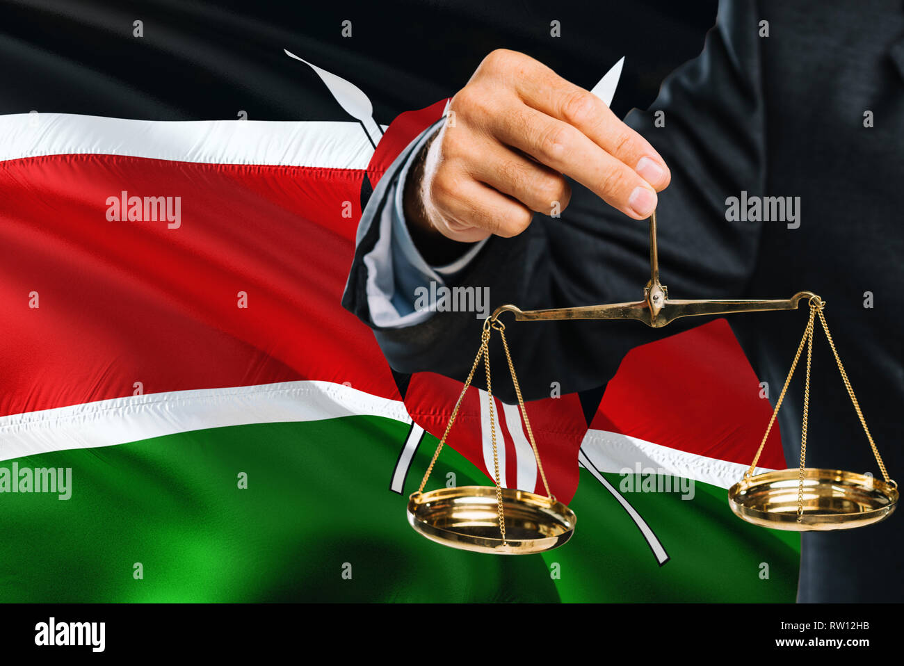 Kenyan Judge is holding golden scales of justice with Kenya waving flag ...