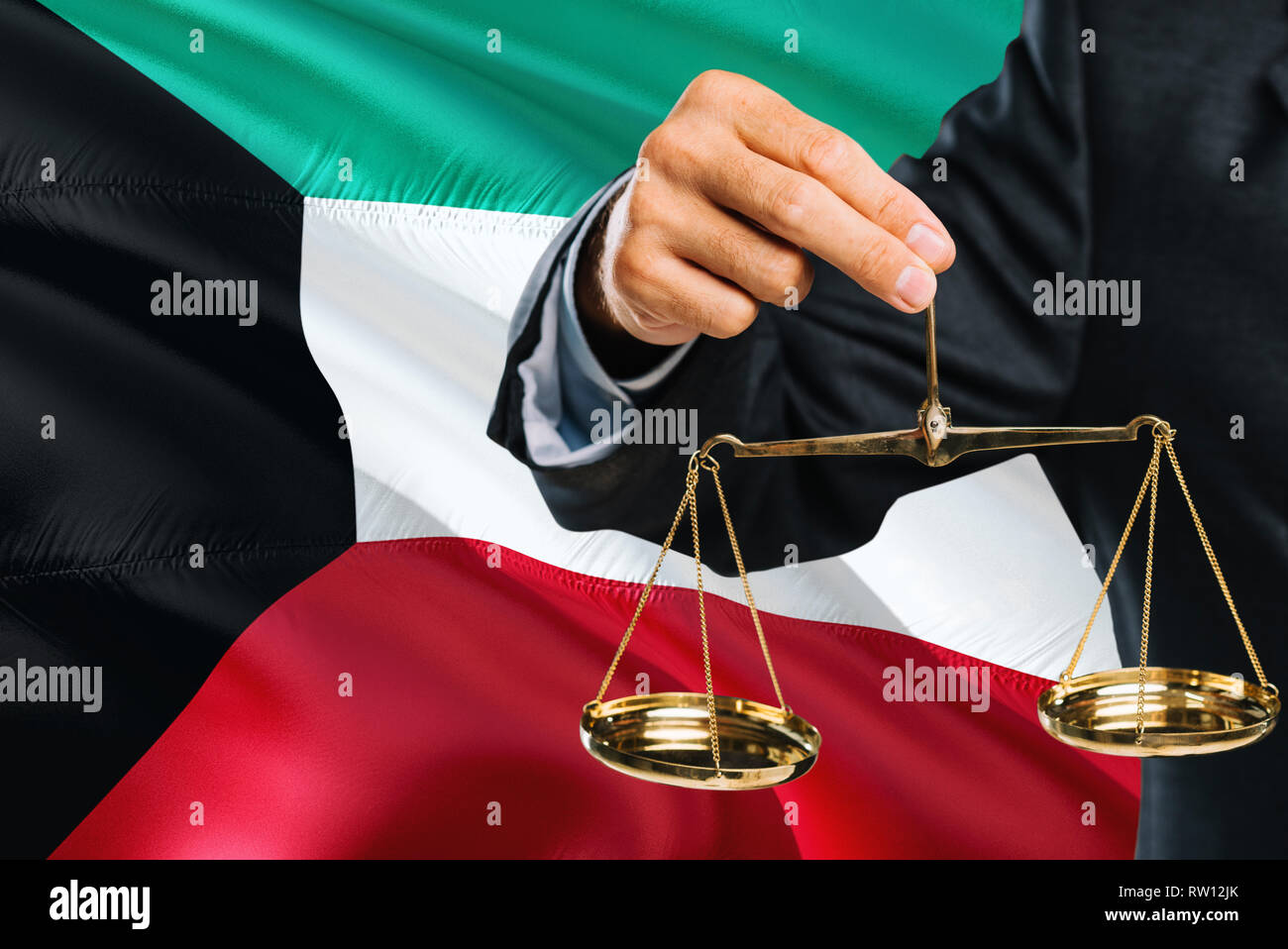 Kuwaiti Judge is holding golden scales of justice with Kuwait waving ...