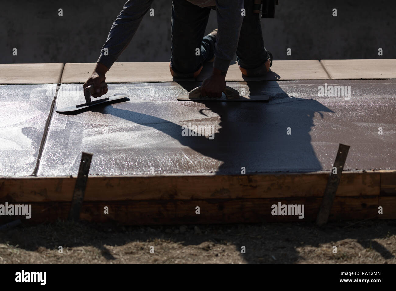 Construction Worker Smoothing Wet Cement With Trowel Tools Stock Photo ...