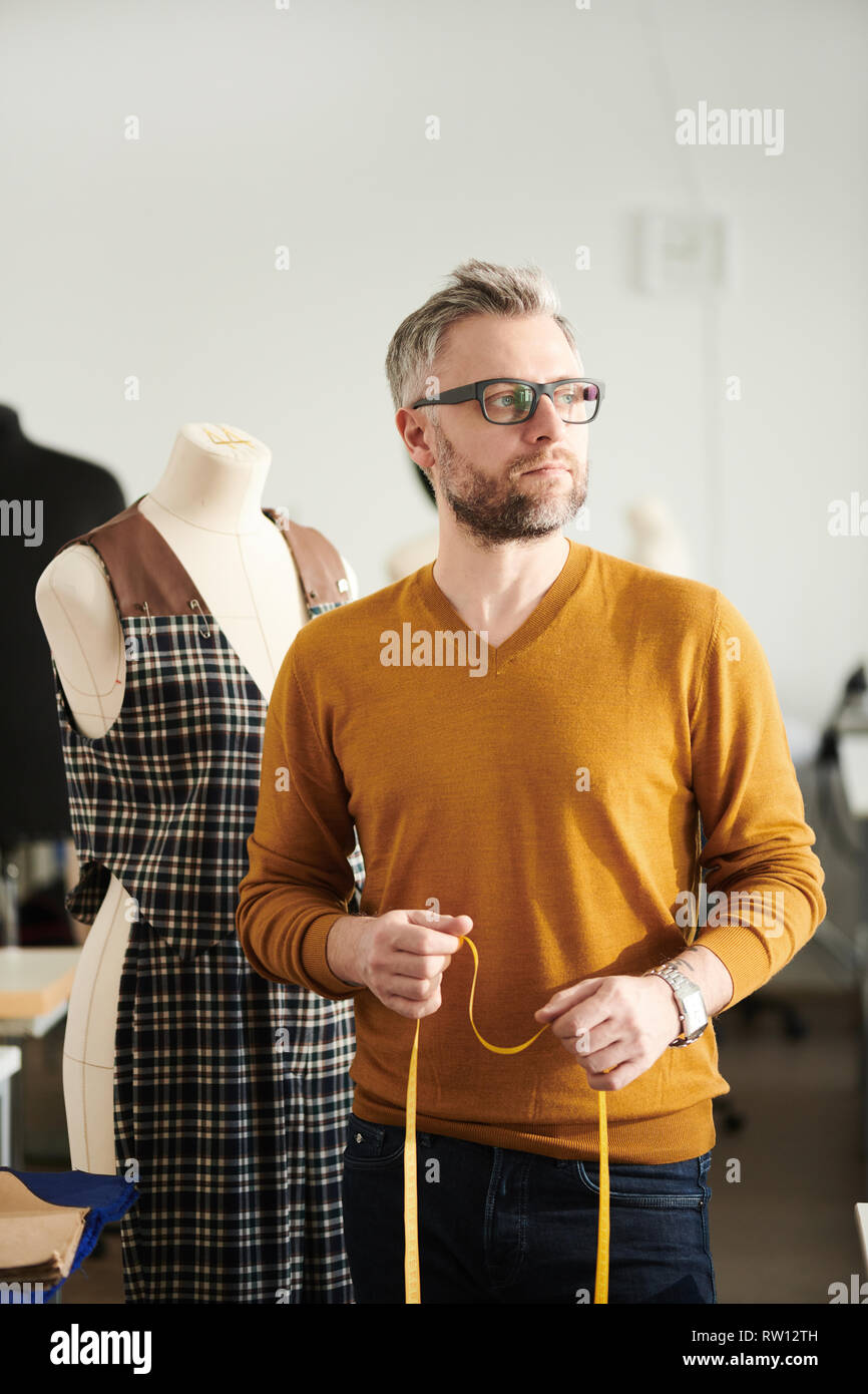 Tailor with tape Stock Photo - Alamy